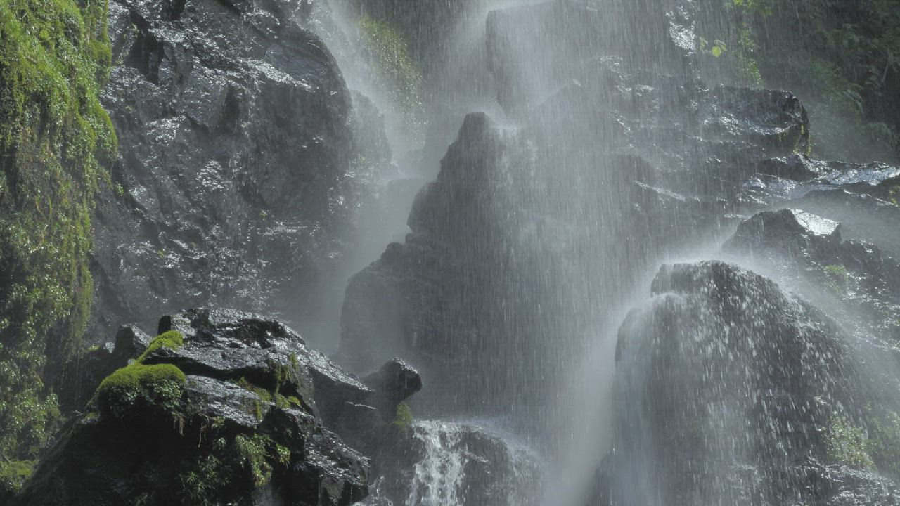 Water falling over stones - Free Stock Video