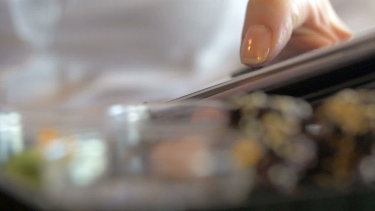 Texting while eating Japanese food - Free Stock Video