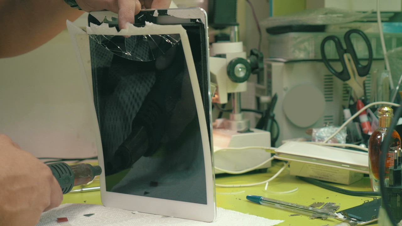 Repairing a broken tablet - Free Stock Video