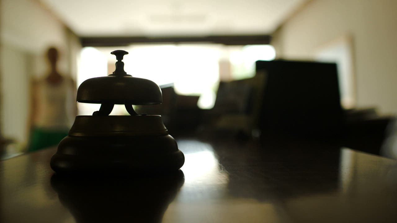 Ringing a bell for service - Free Stock Video