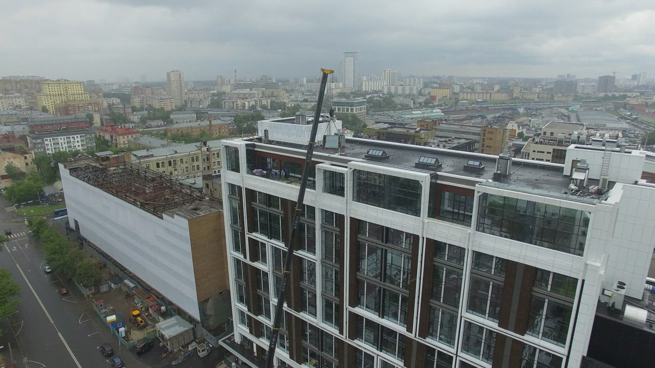 Crane lifting window panels - Free Stock Video