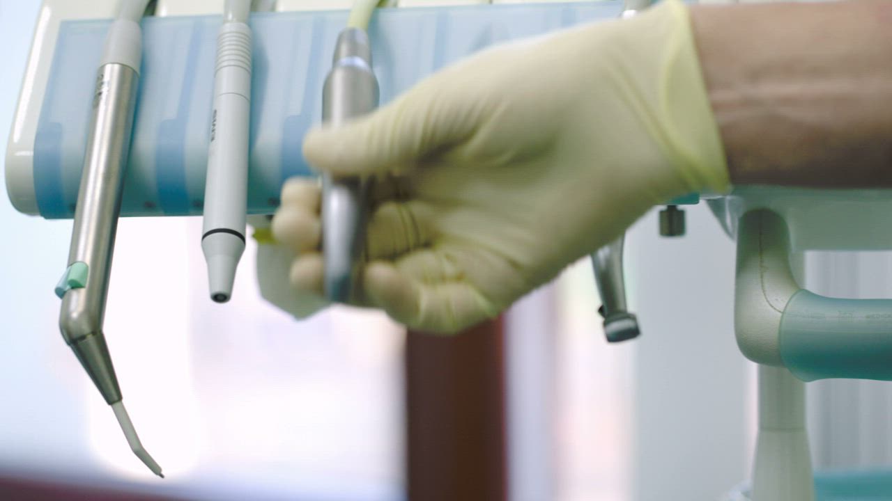 Dentist returning a tool - Free Stock Video