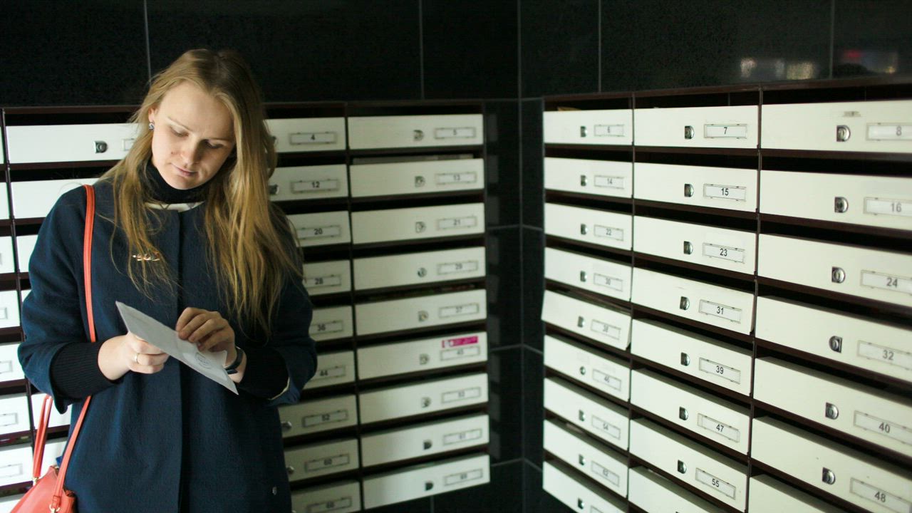 Woman checking her mail - Free Stock Video