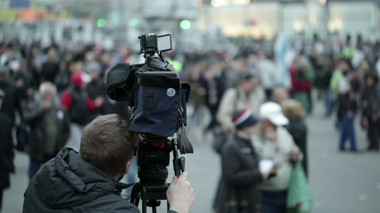 Cameraman filming in the city - Free Stock Video