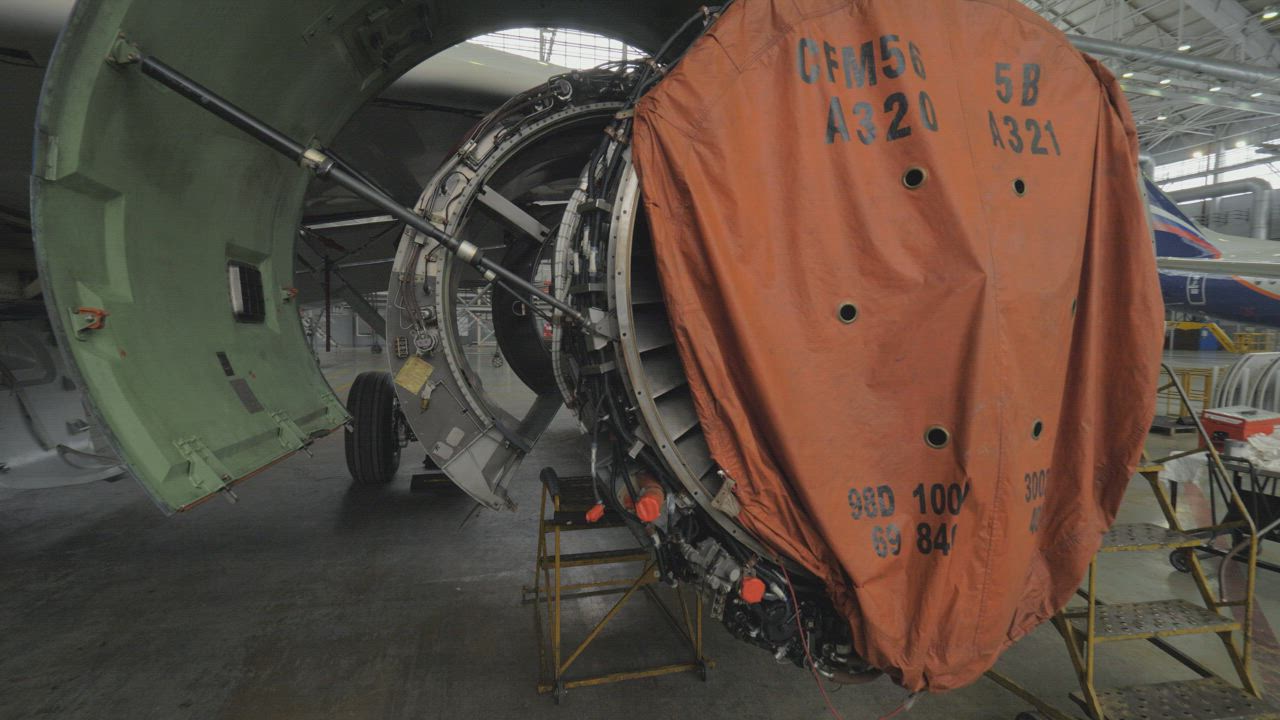 Engineers working on a jet engine - Free Stock Video