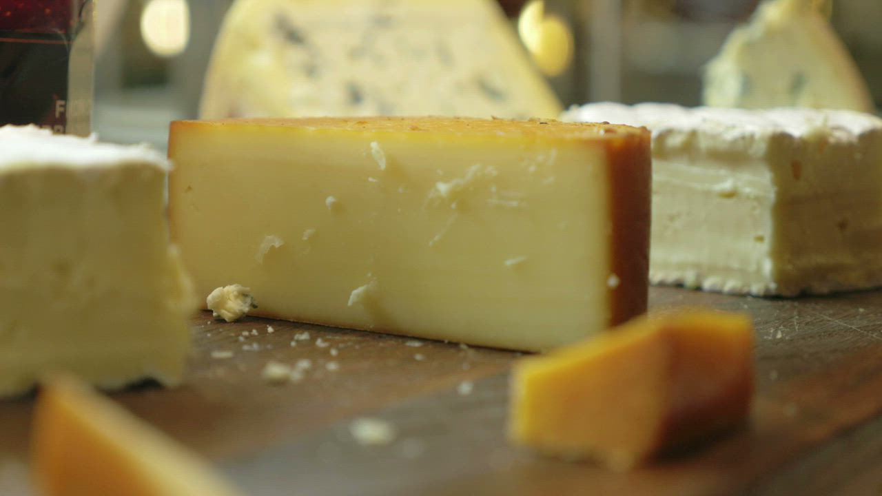 Cutting a chunk of cheese - Free Stock Video