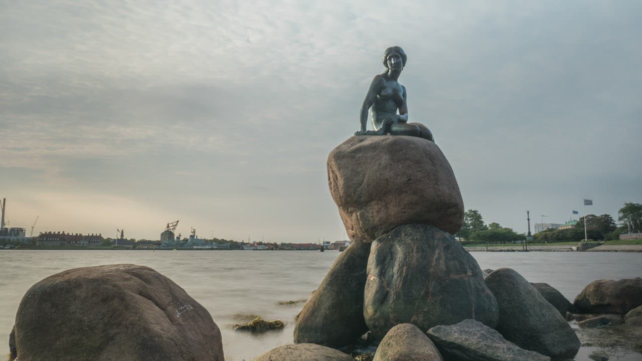 Mermaid statue by the ocean - Free Stock Video