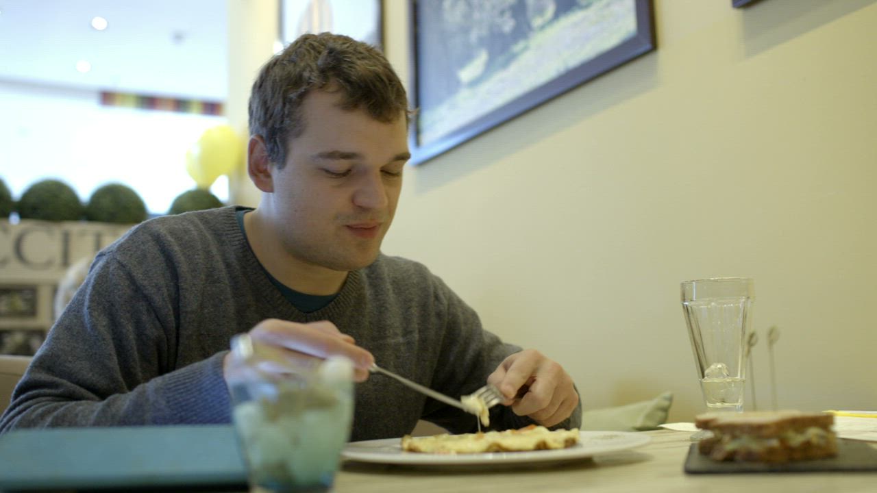 Chatting online in a cafe - Free Stock Video