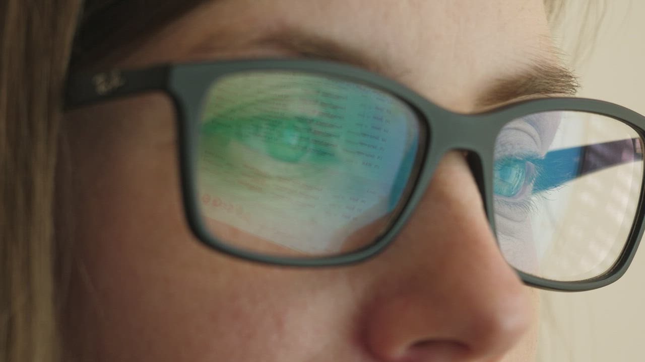 Reflection of a screen in glasses - Free Stock Video