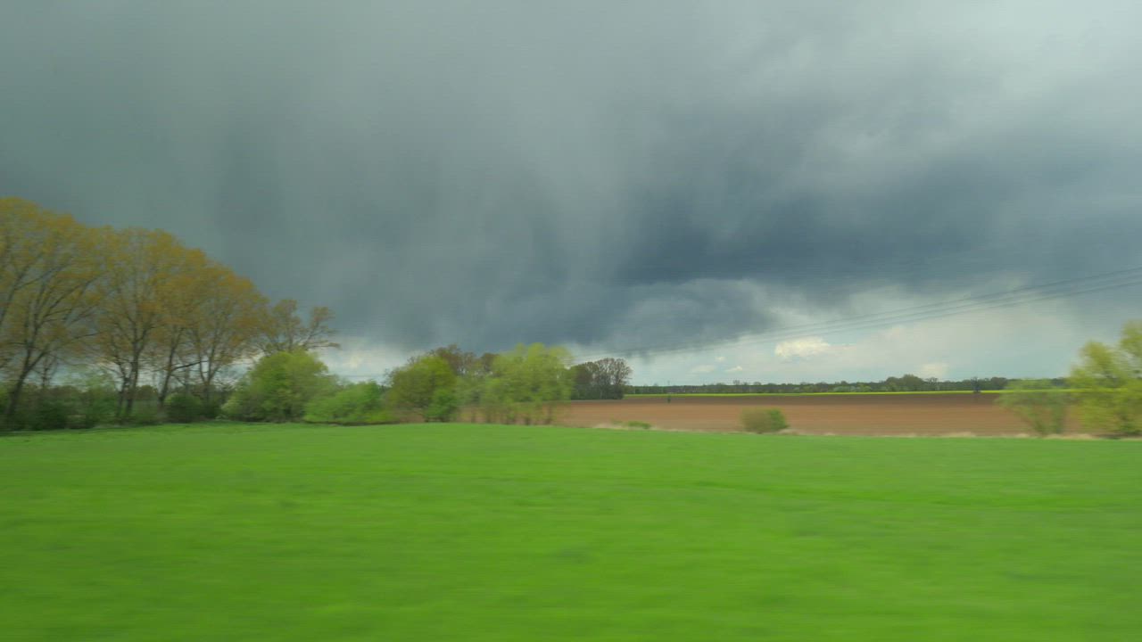 Distant rain across the countryside - Free Stock Video