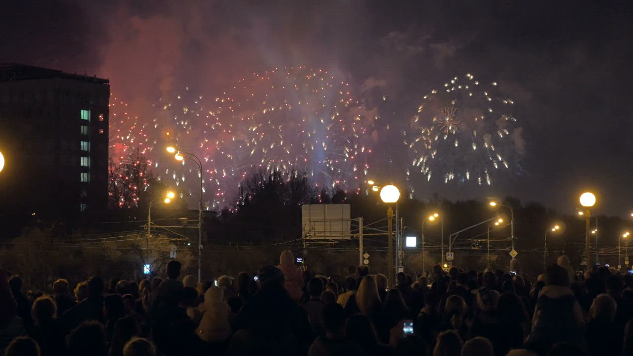 Fireworks over a city street - Free Stock Video