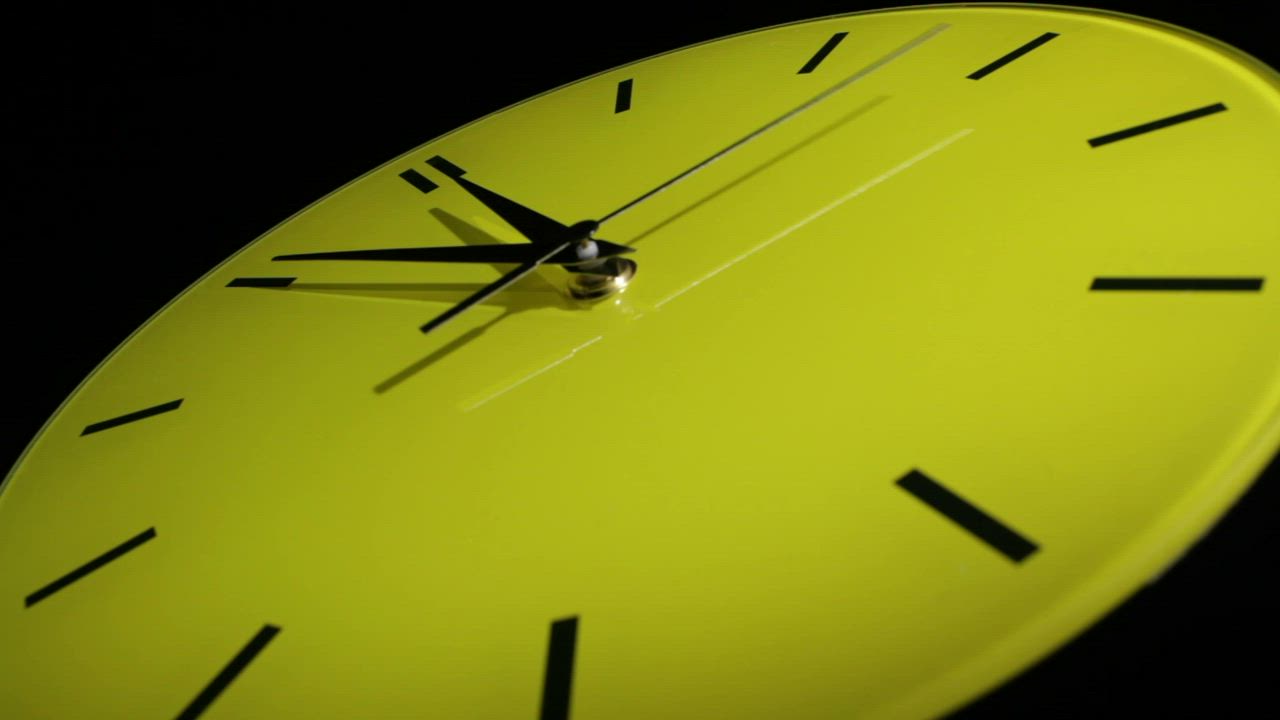 Timelapse of a yellow clock - Free Stock Video