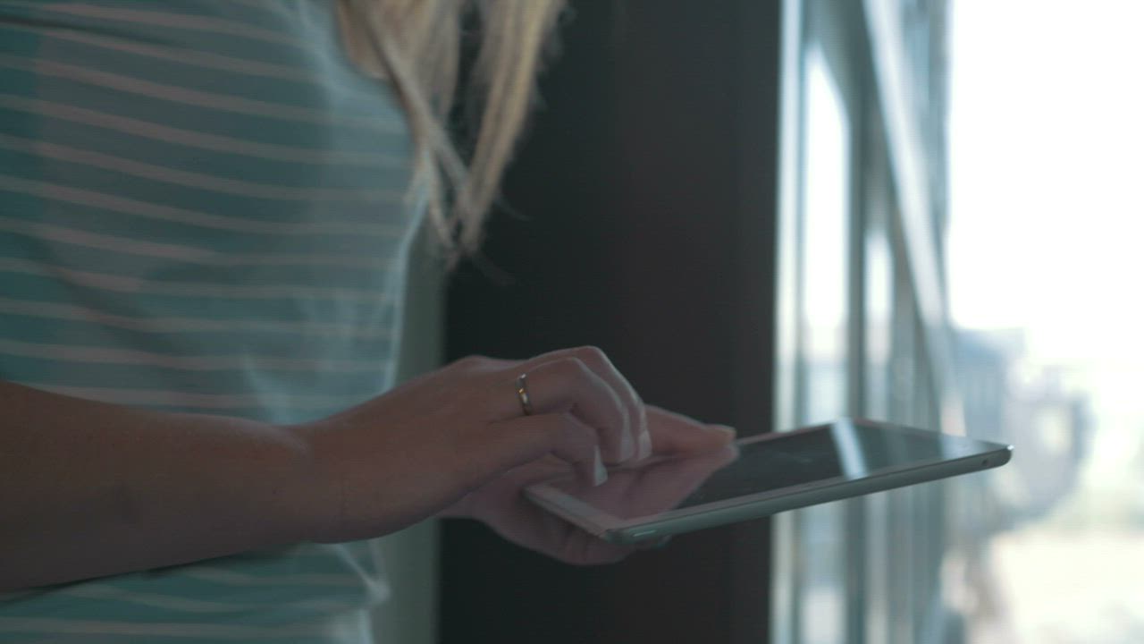 Walking quickly with a tablet - Free Stock Video