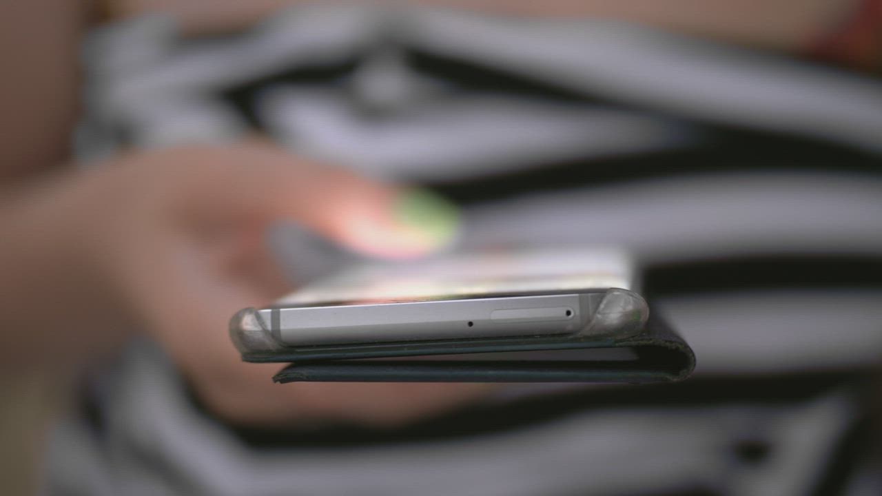 Browsing online via a smartphone - Free Stock Video