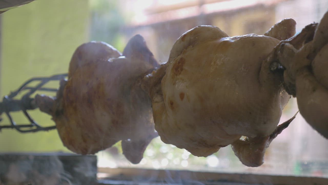 Chickens cooking on a spit - Free Stock Video