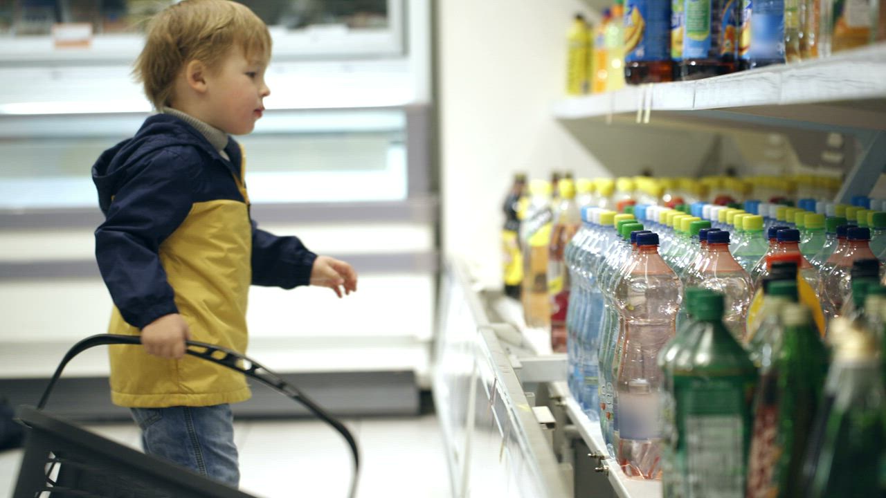 Little boy helping with the shopping - Free Stock Video