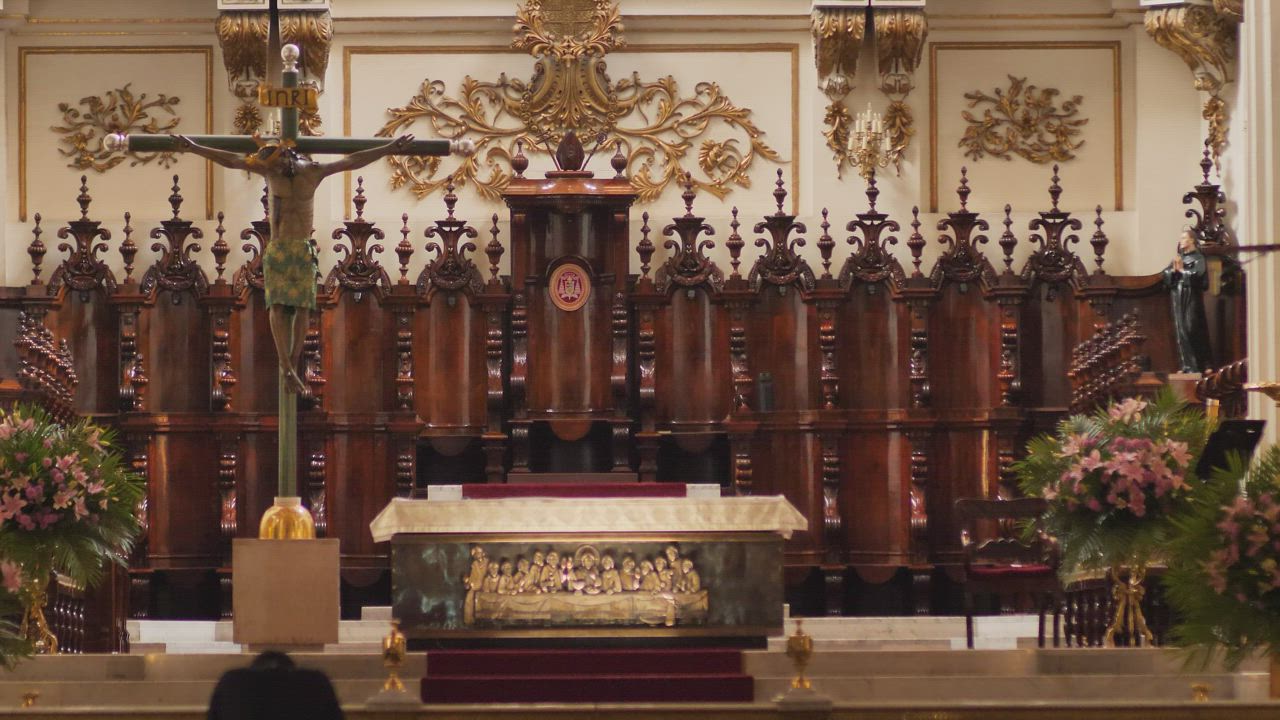 Altar the front of the interior of a church detailed with gilding ...