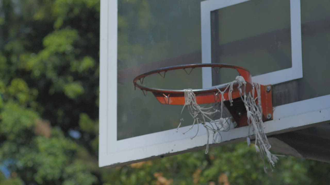 A person doing a slam dunk - Free Stock Video