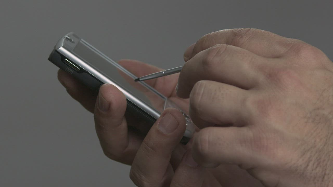 Businessman with an old PDA - Free Stock Video