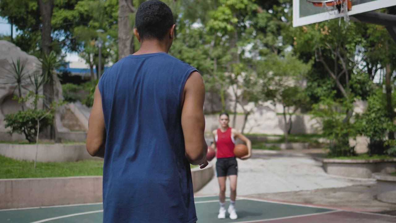 Couple passing a ball - Free Stock Video