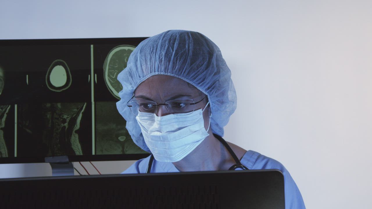 Surgeon reviewing CT scans - Free Stock Video