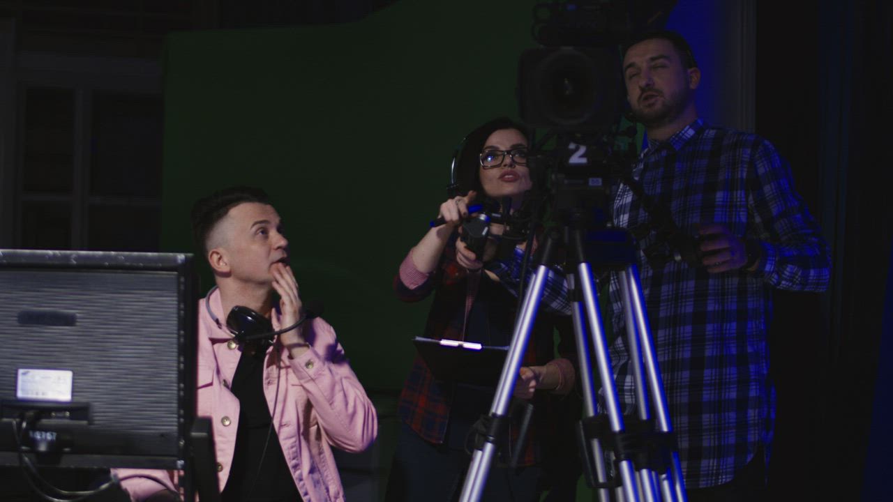 Production team having a discussion - Free Stock Video