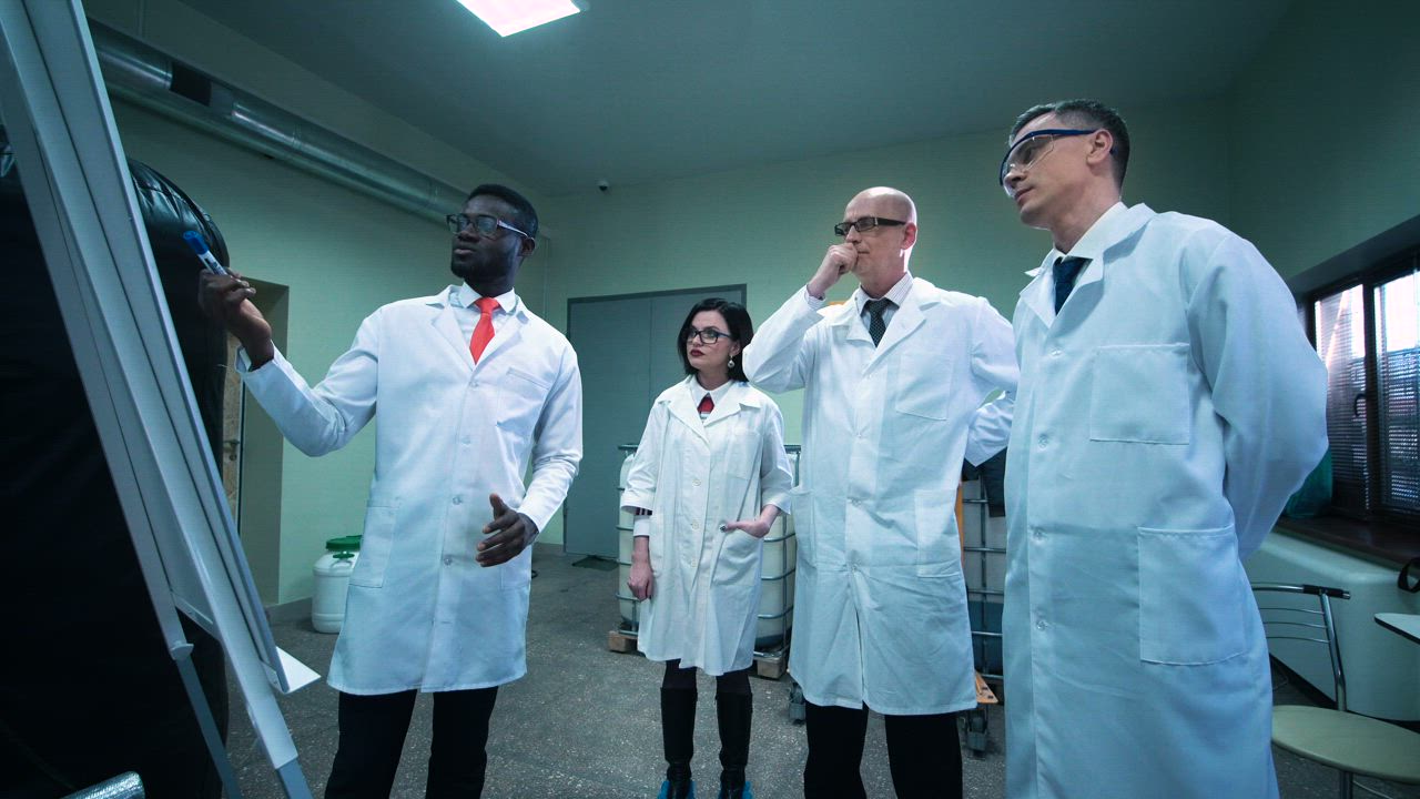 Four scientists talking about research - Free Stock Video