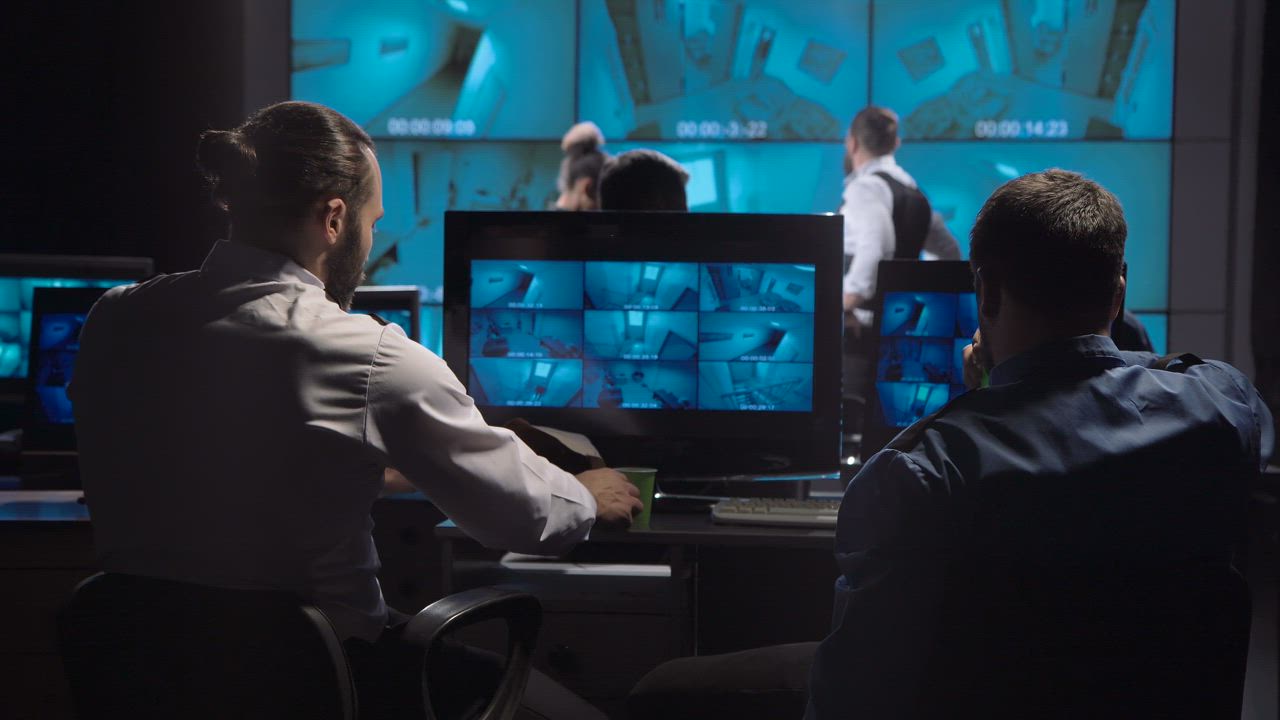 Surveillance security guards eating donuts - Free Stock Video