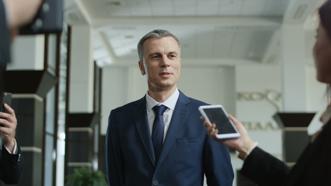 Important man giving an interview on the hall - Free Stock Video
