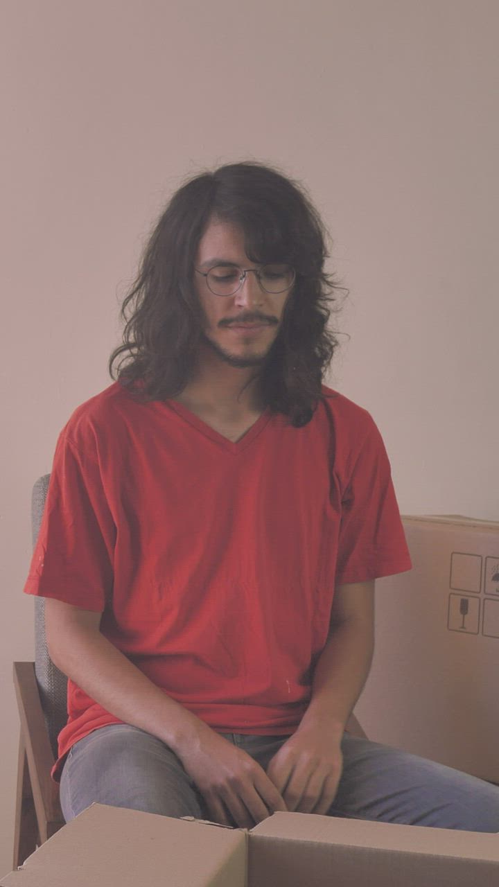 A couple flicking through a book together - Free Stock Video