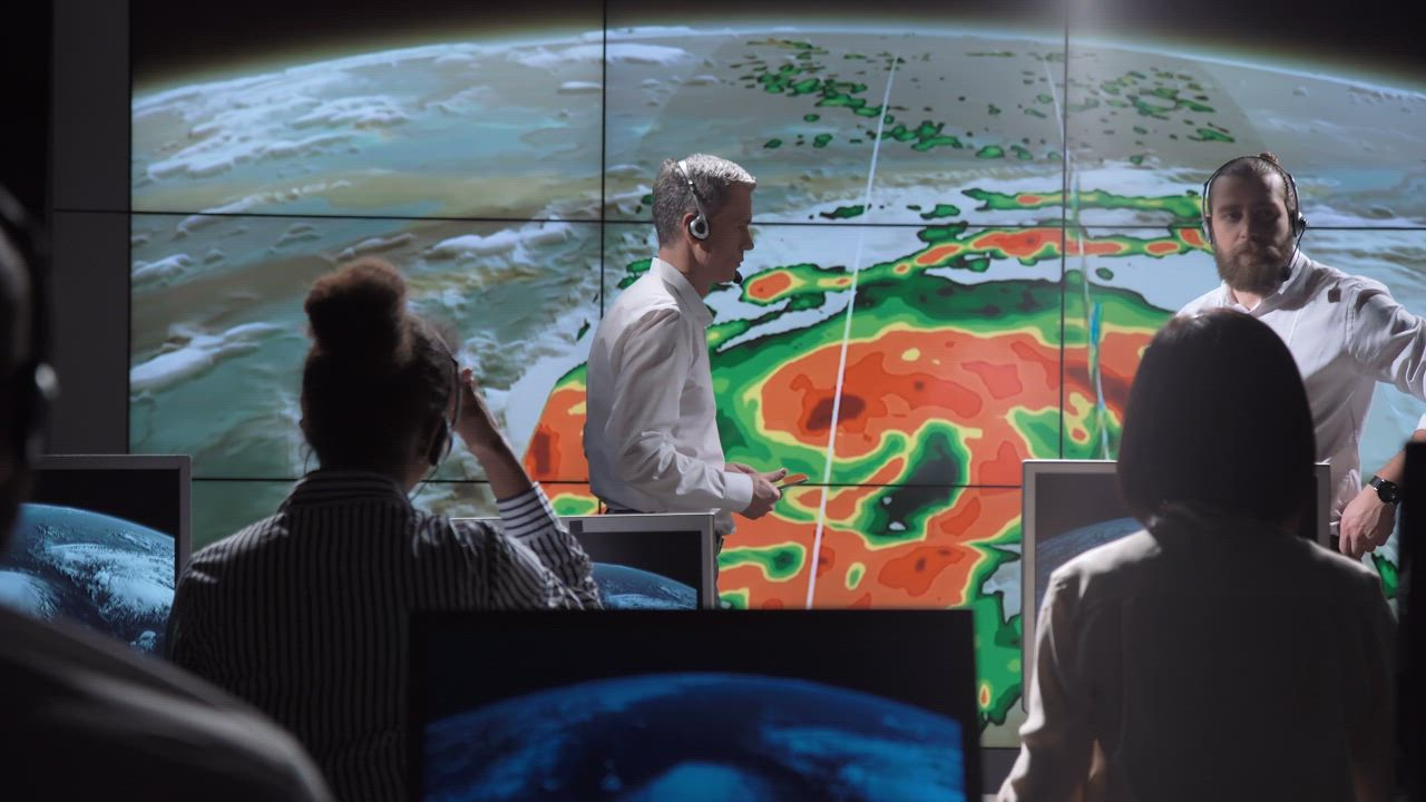 Researchers tracking hurricane on the monitor - Free Stock Video