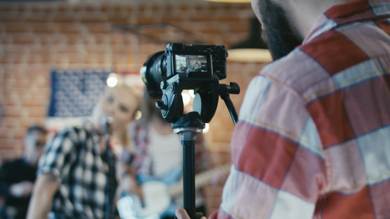 Man filming a musical band - Free Stock Video