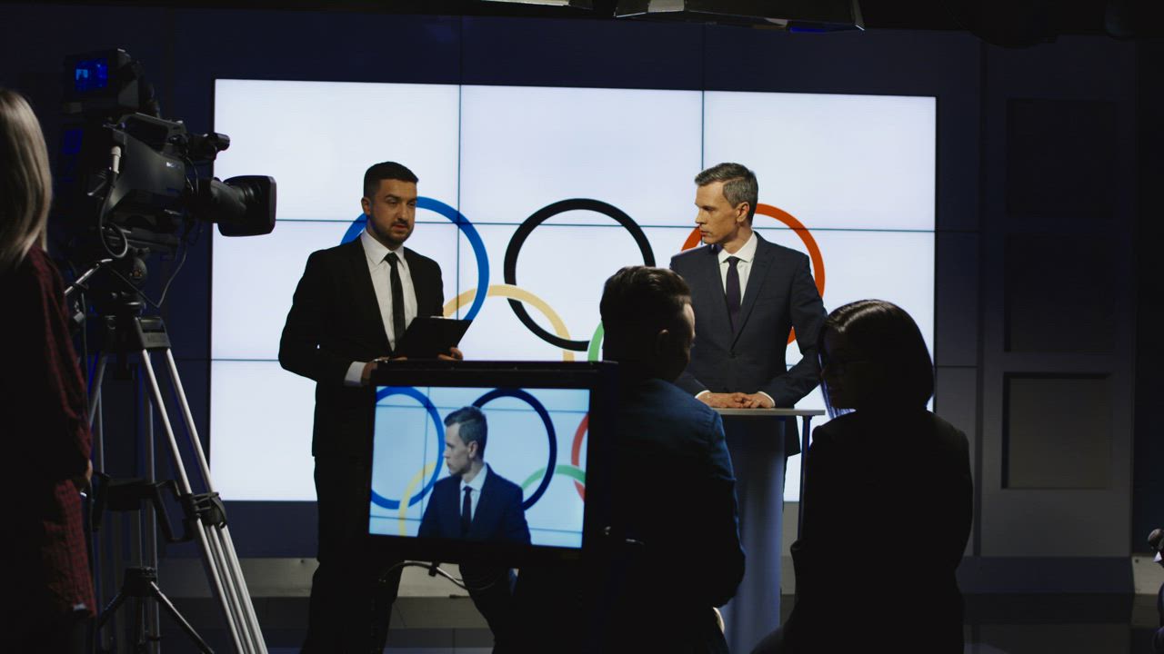Olympics spokesman on a television interview - Free Stock Video