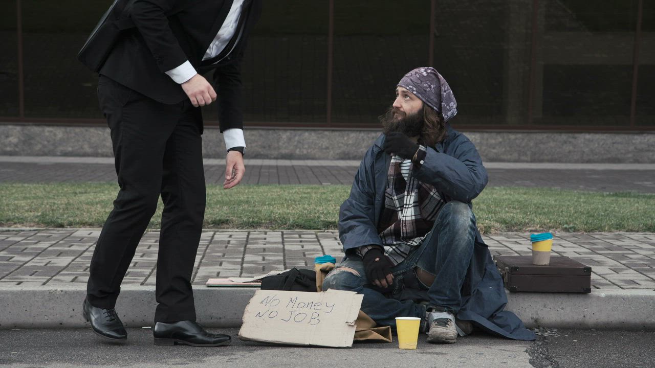 Business man and beggar sitting on the street - Free Stock Video