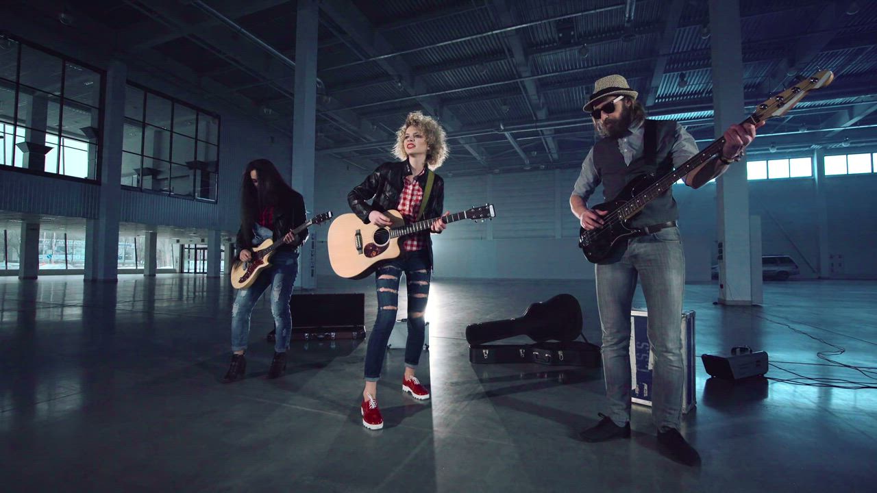 Music band shooting video in an empty warehouse - Free Stock Video