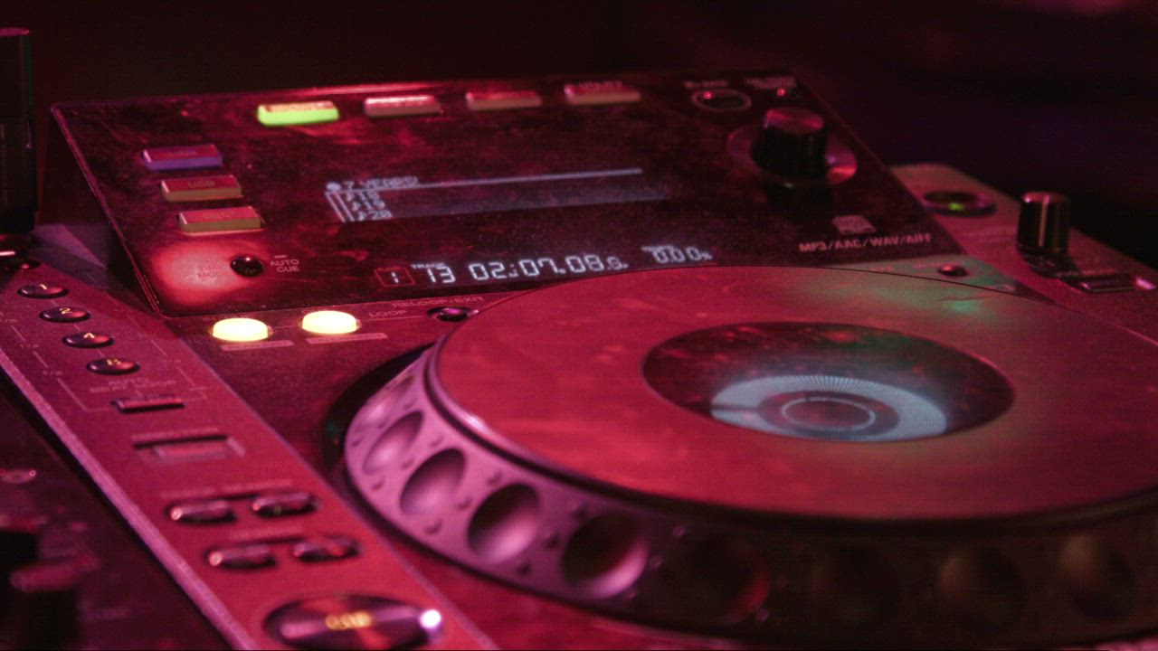 DJ equipment in the room with club lights - Free Stock Video