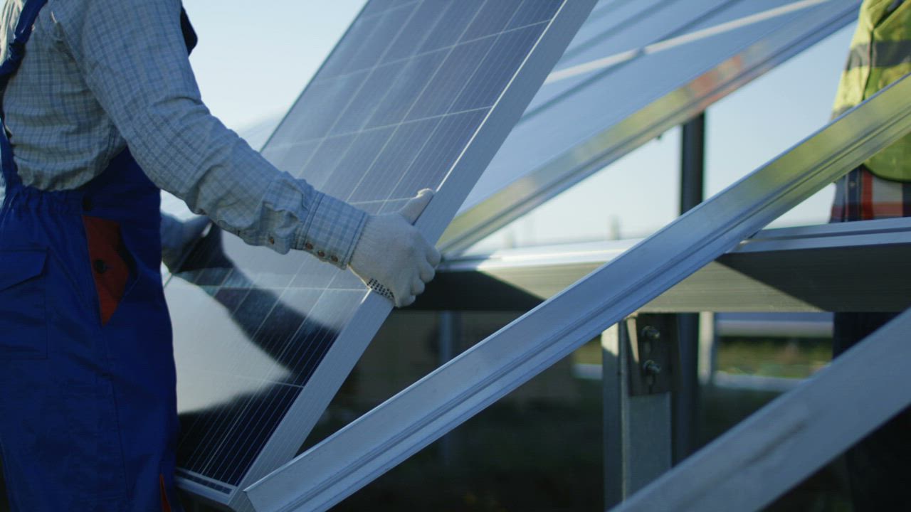 Installing a solar panel close up - Free Stock Video