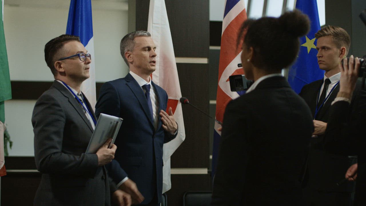 Politician giving interviews to reporters - Free Stock Video