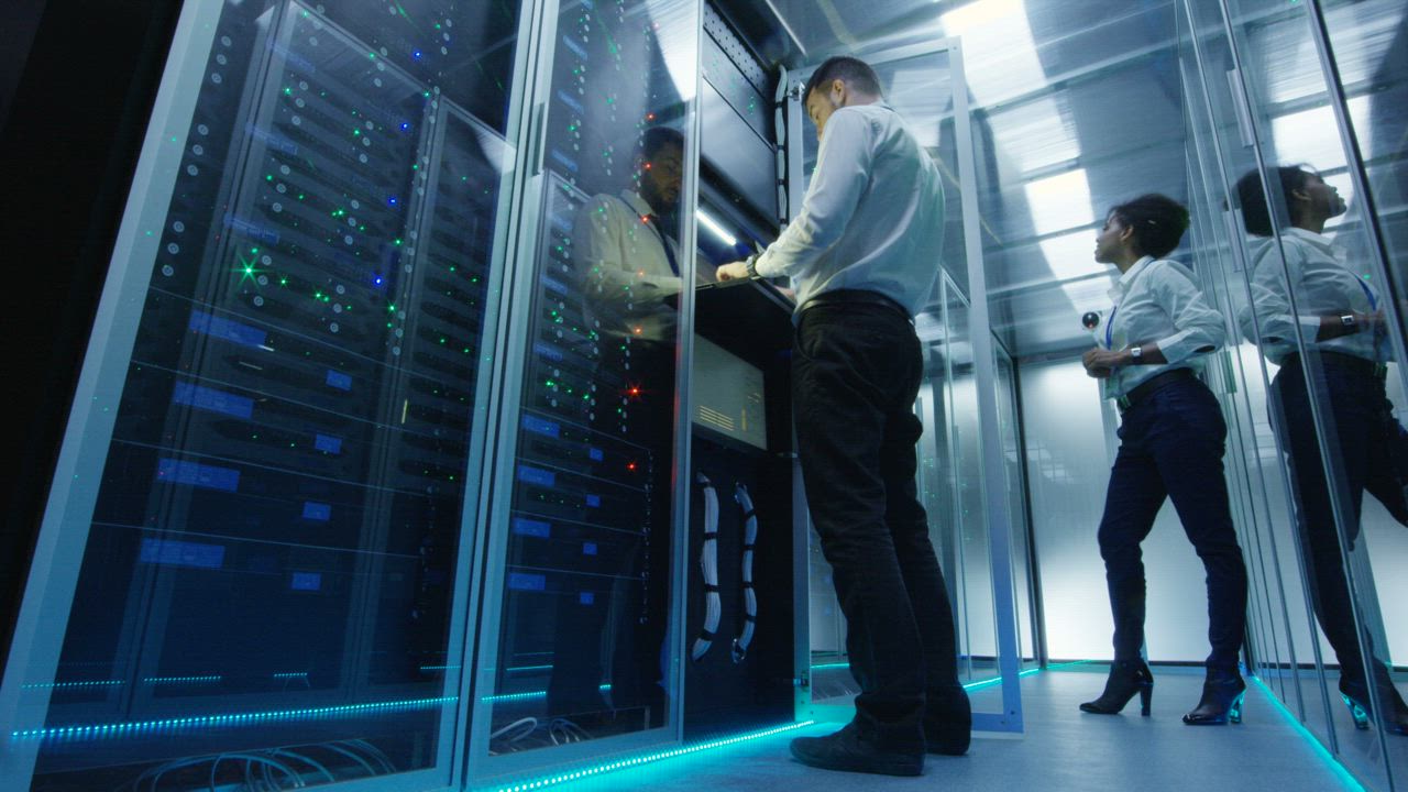 Time lapse of engineers working in a data center - Free Stock Video