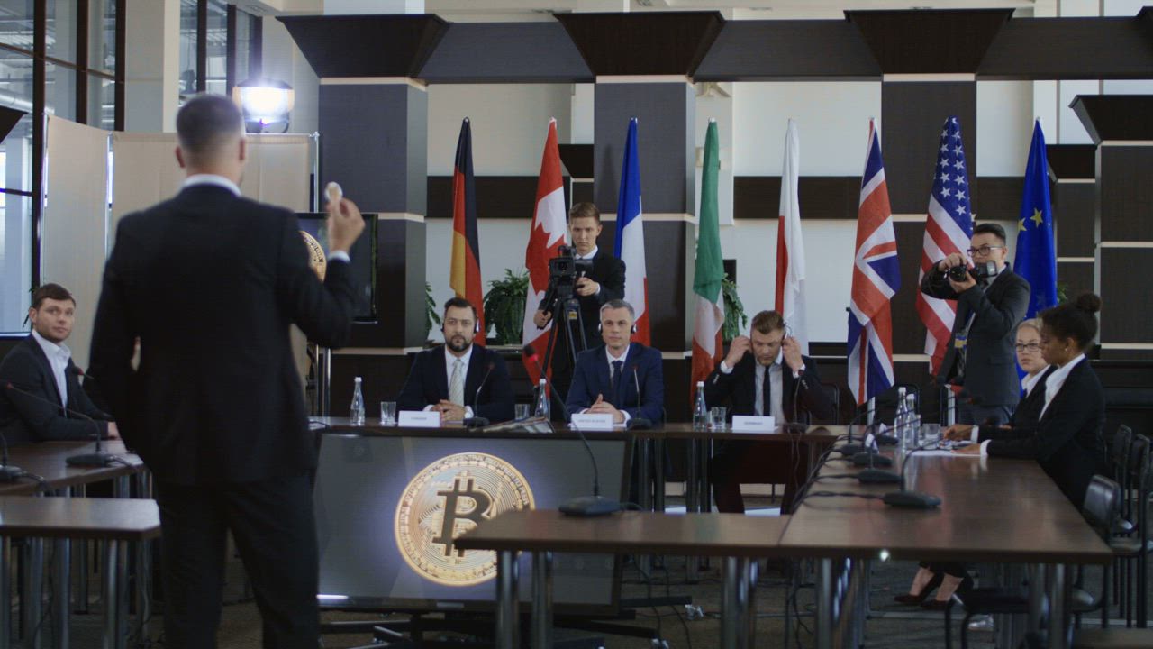 Members of the conference discussing bitcoin - Free Stock Video