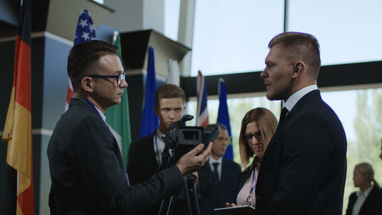 The politician being interviewed by a journalist - Free Stock Video