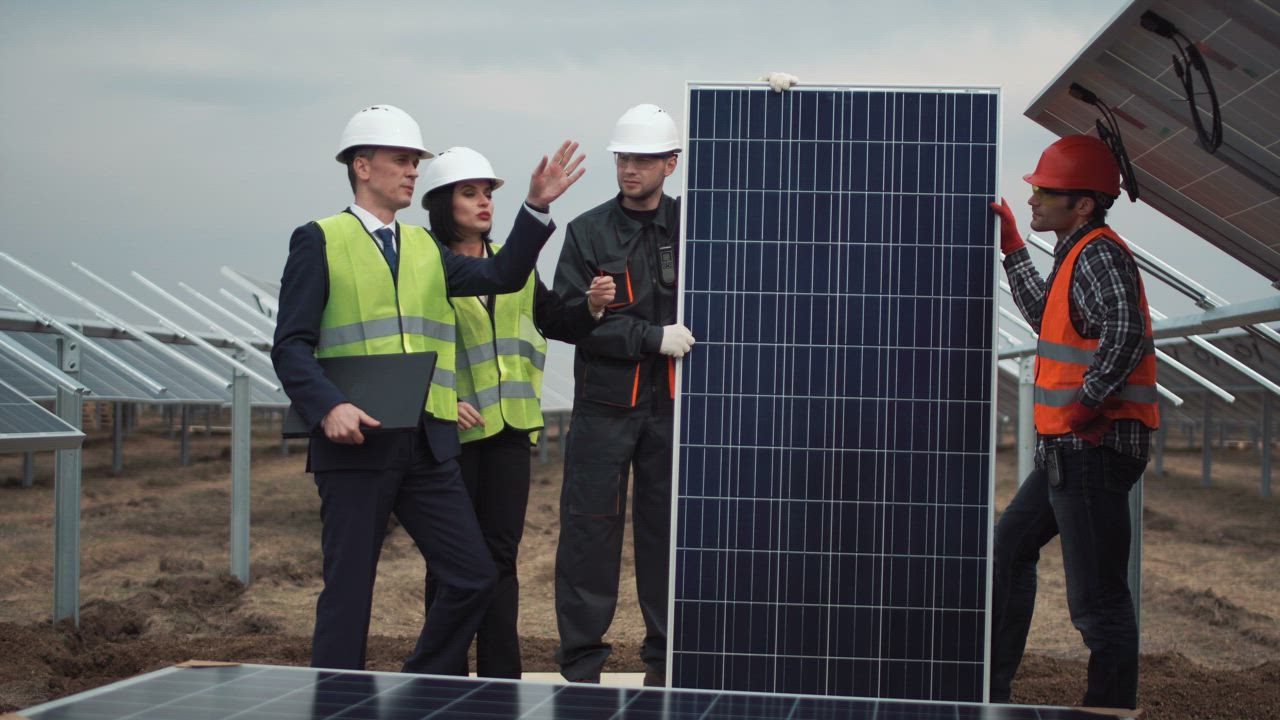 Team of engineers working with solar panels - Free Stock Video