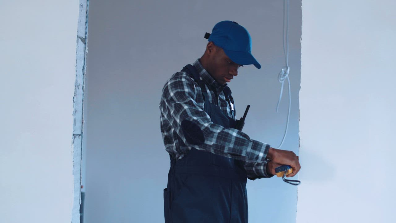 Man taking measurements in a building - Free Stock Video