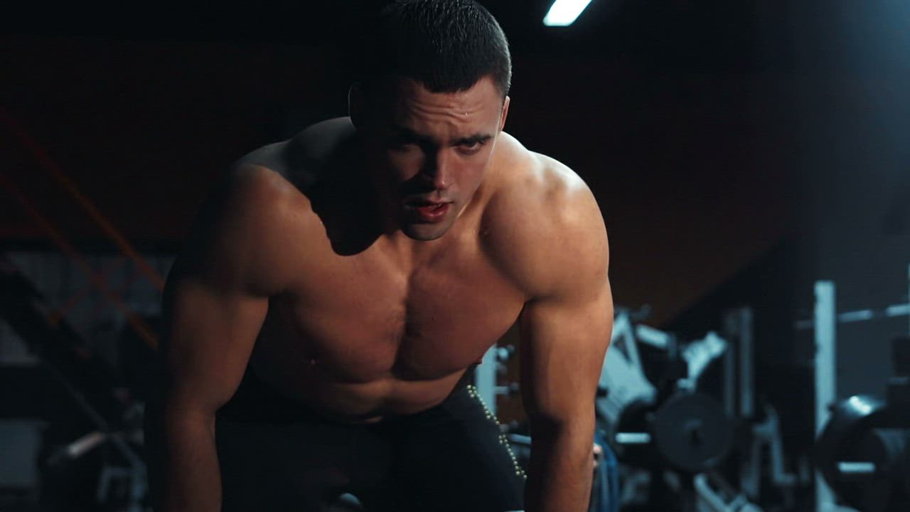 Tired bodybuilder in the gym - Free Stock Video