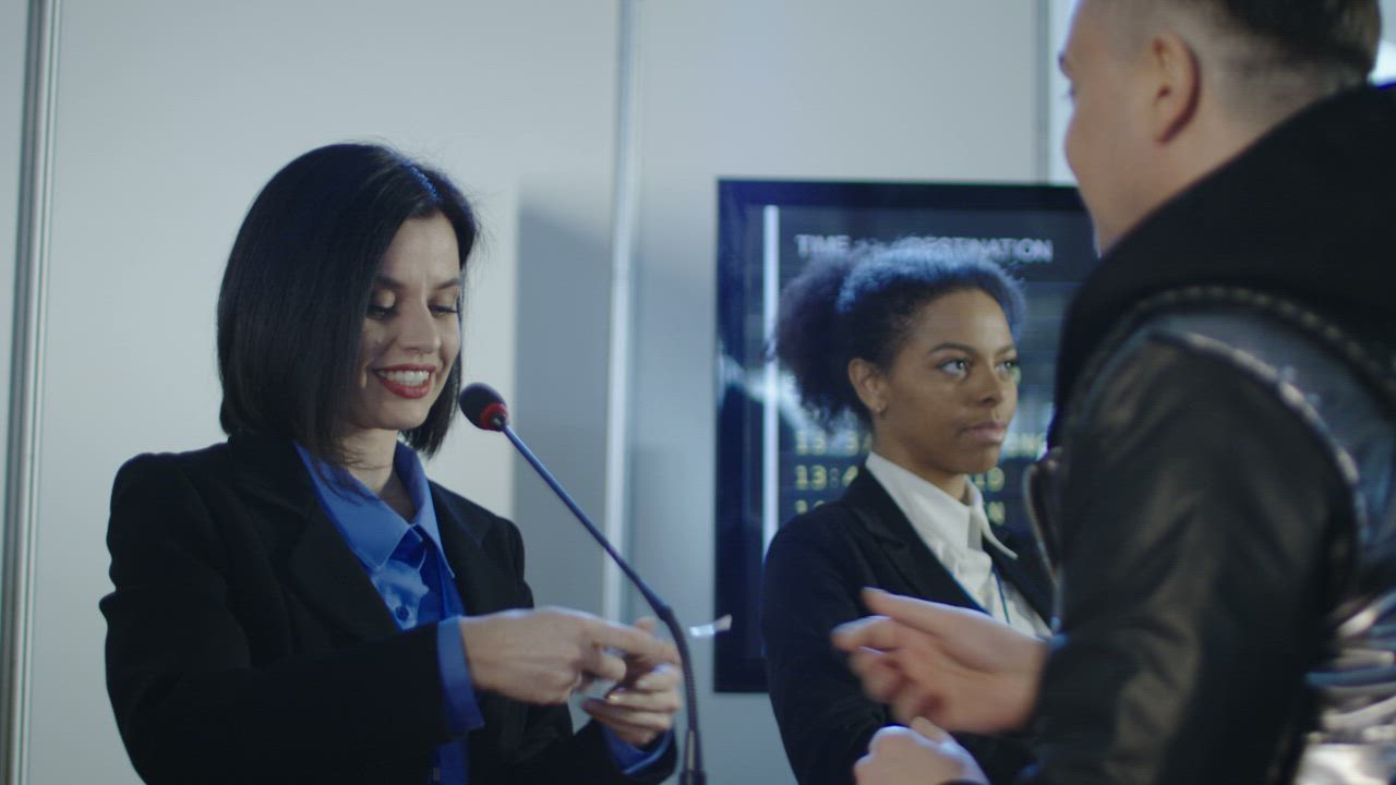 Man doing the check-in for the flight - Free Stock Video