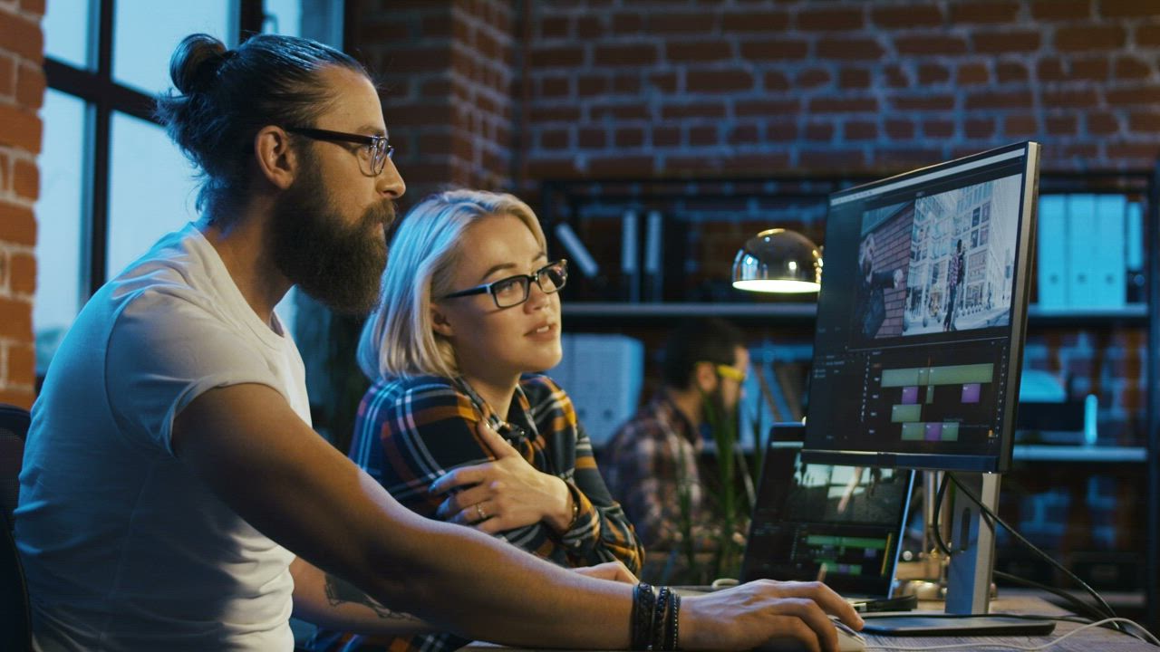 Colleagues working on video editing - Free Stock Video