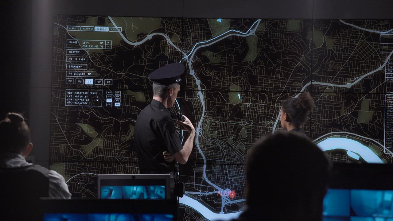 Policemen in front of an interactive map - Free Stock Video