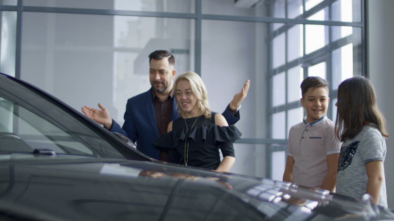 Family buying a new car in the dealership - Free Stock Video