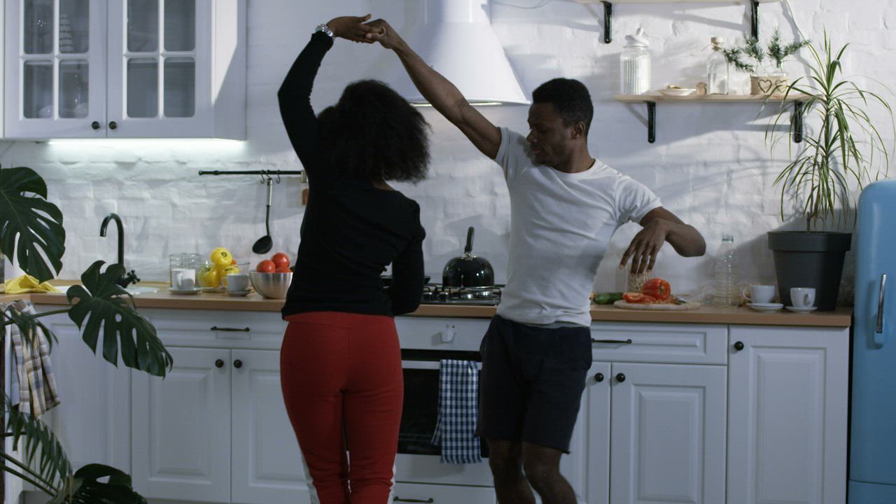 Young couple dancing in the kitchen - Free Stock Video