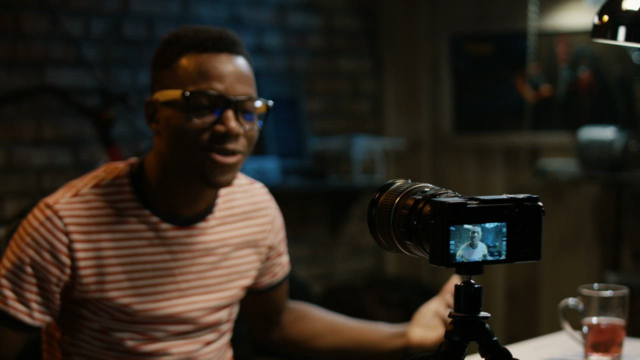 A young man recording himself with a camera - Free Stock Video